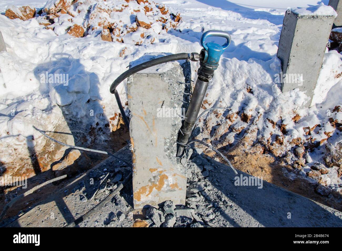 Demolition of concrete structures at the construction site. Preparing a ...