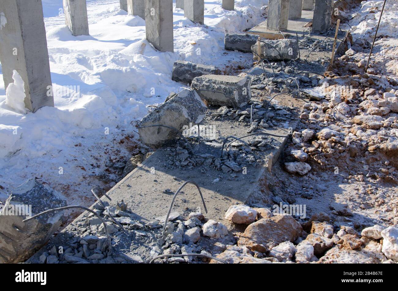 Demolition of concrete structures at the construction site. Preparing a ...