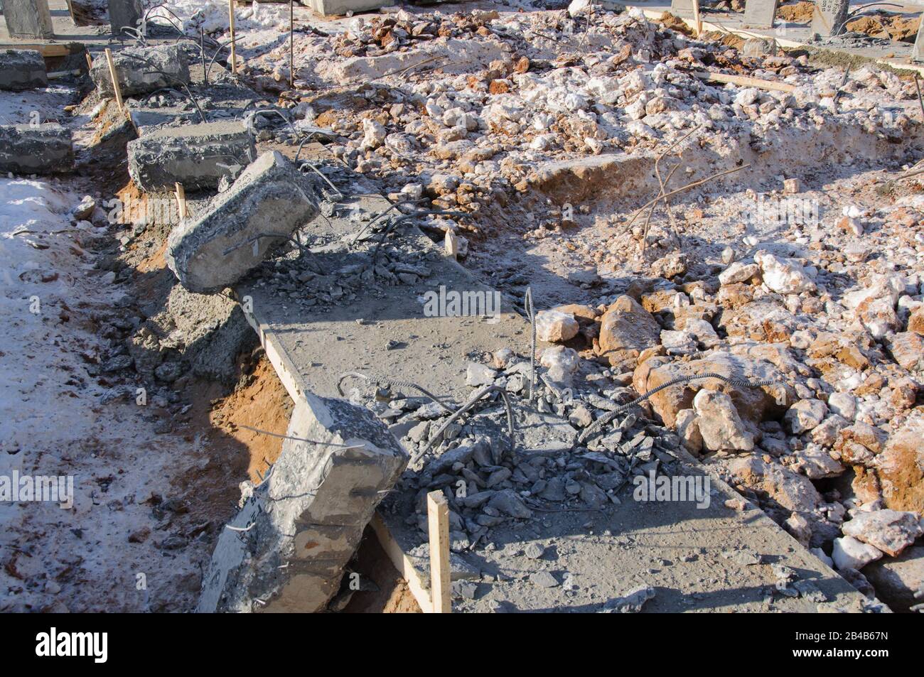 Demolition of concrete structures at the construction site. Preparing a ...