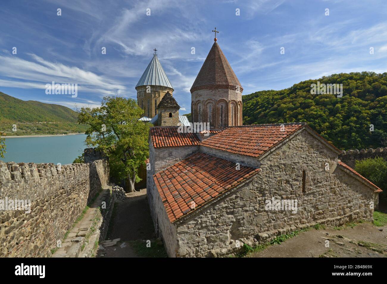 Medieval Ananuri complex: surrounded wall and churches against azure ...