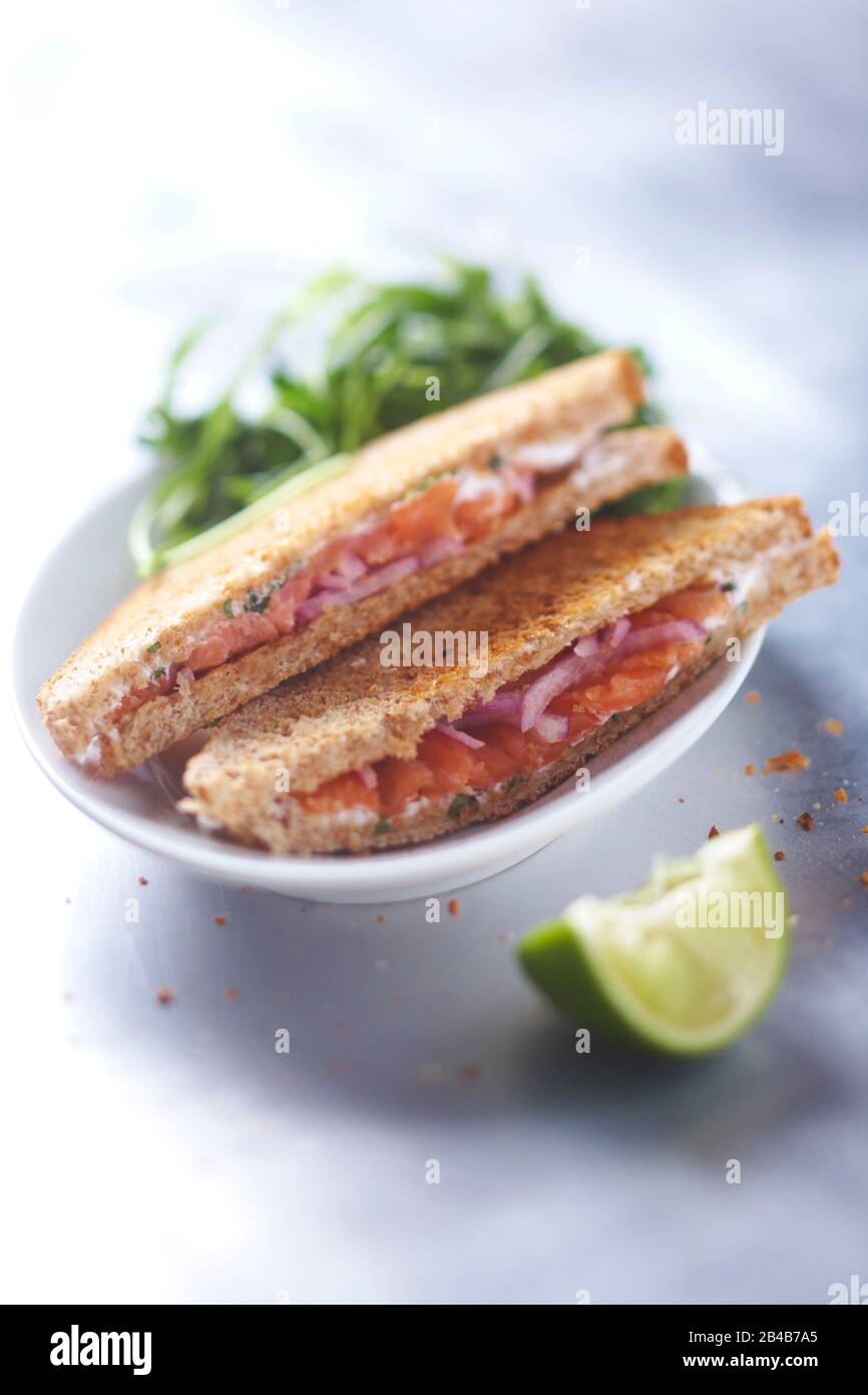 Lemon onion salmon toast Stock Photo - Alamy