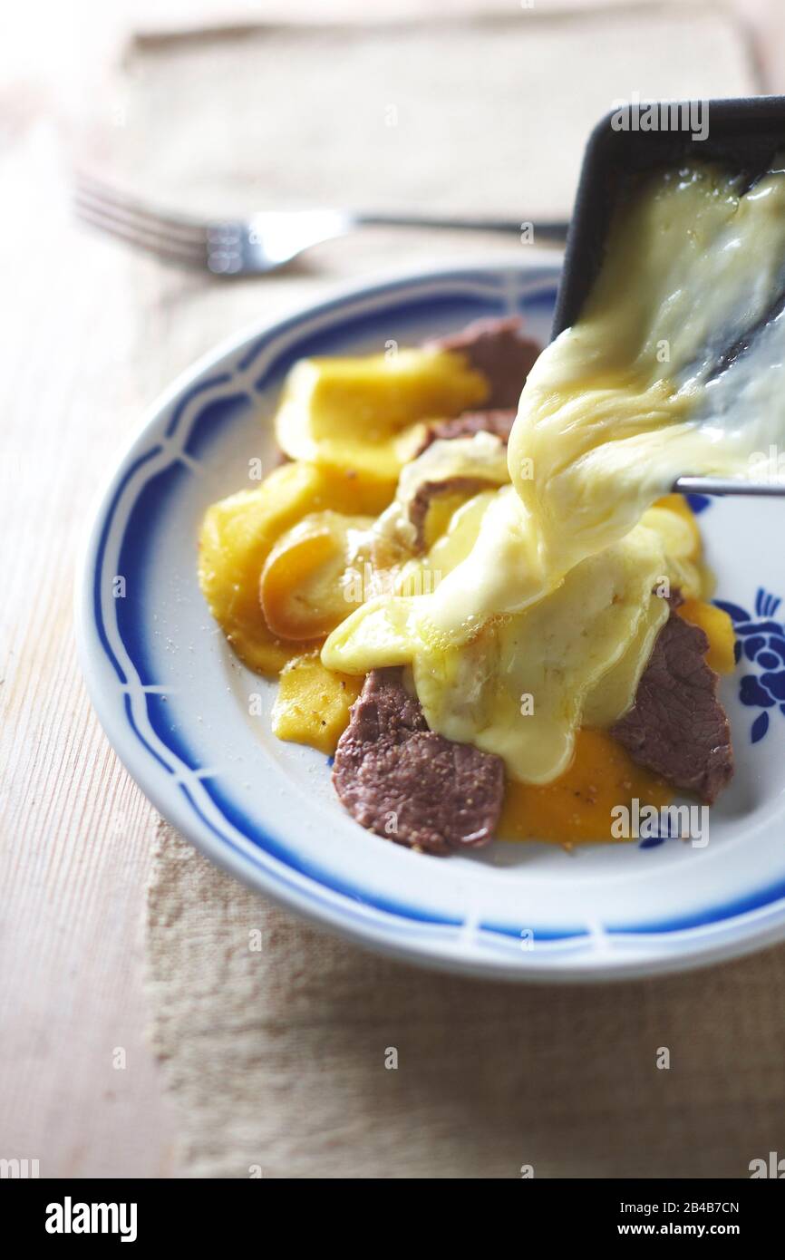 Melted cheese, mango beef raclette Stock Photo - Alamy