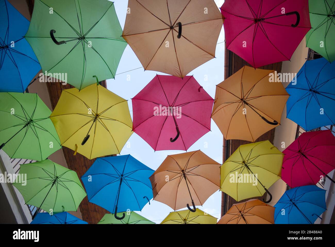 Many bright multicoloured umbrellas seen from above Stock Photo - Alamy