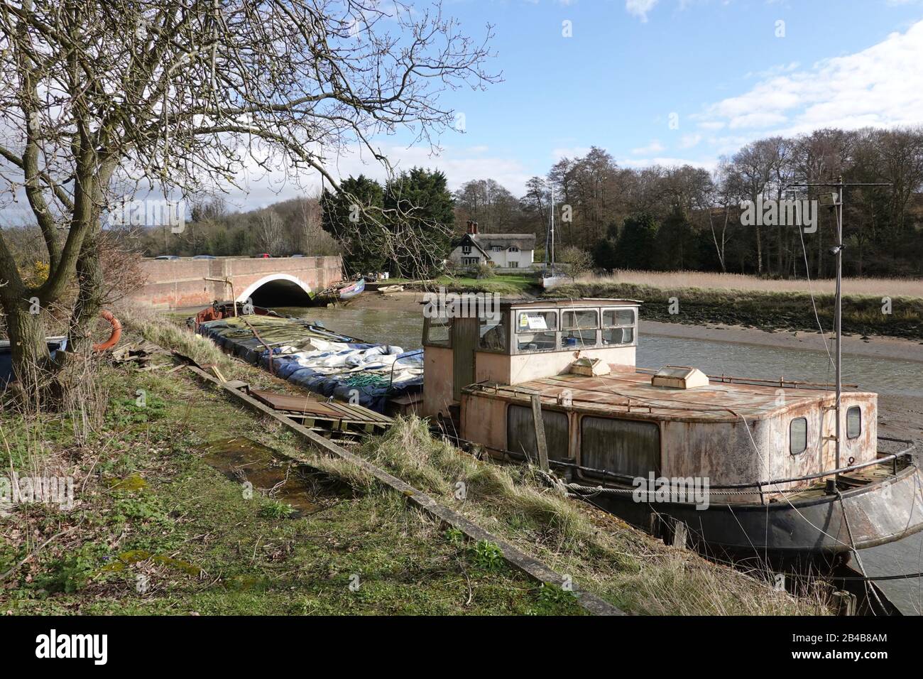 Woodbridge, Suffolk, UK - 6 March 2020: Derelict boat alongside the ...