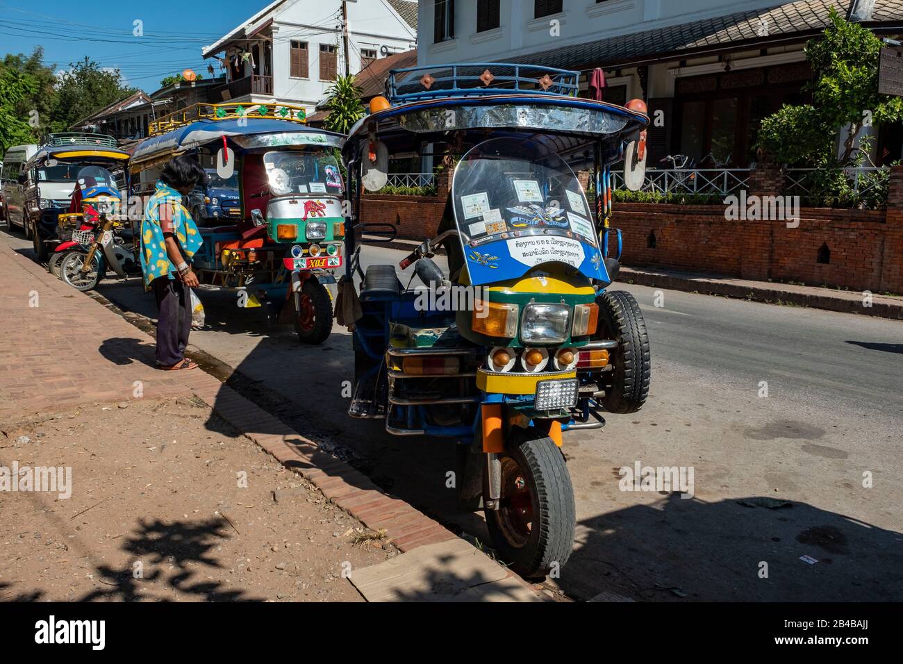 Laos, Luang Prabang, rickshaw in the street along the Mekong river ...
