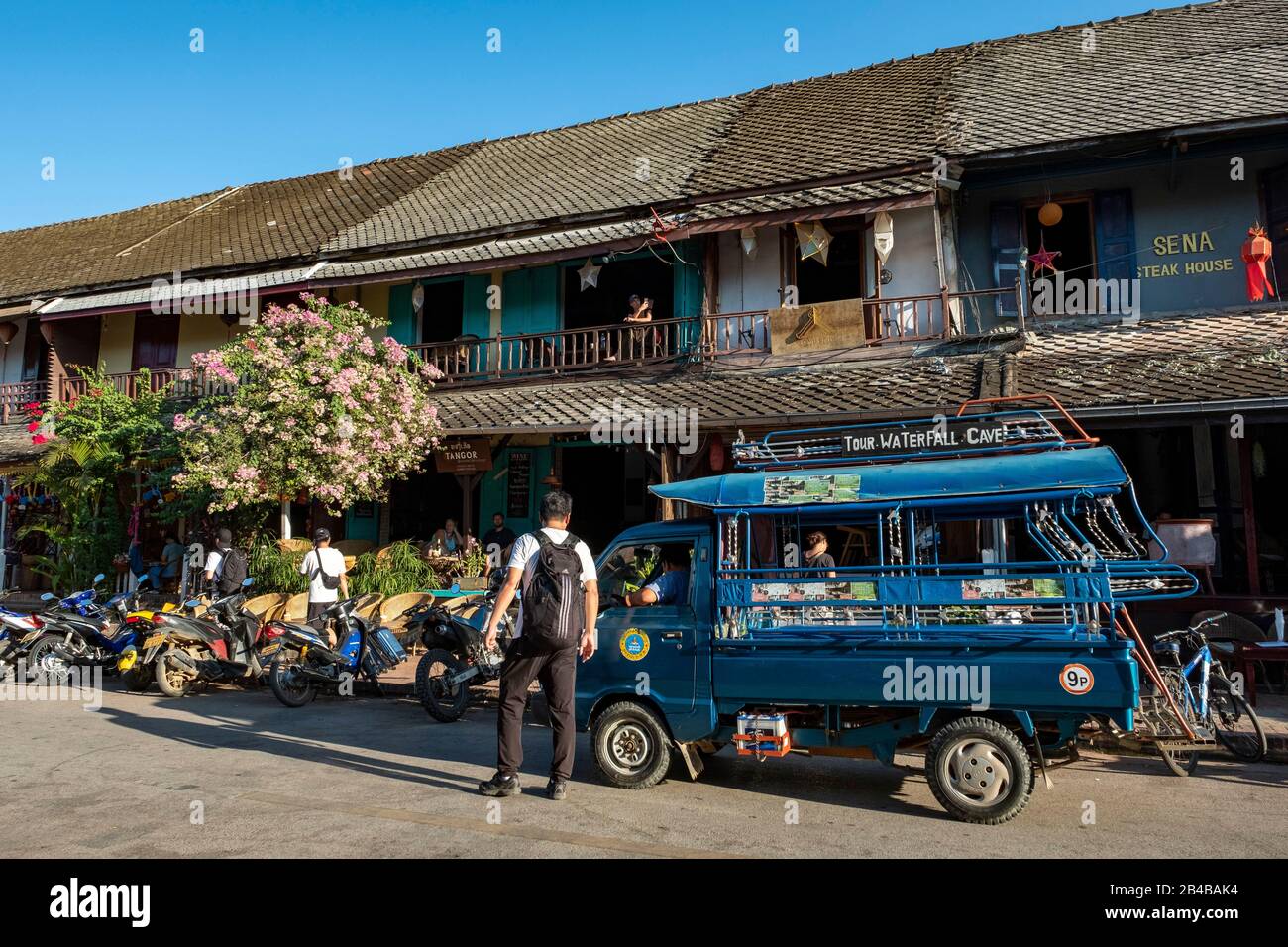 Laos, Luang Prabang, rickshaw in the street along the Mekong river ...