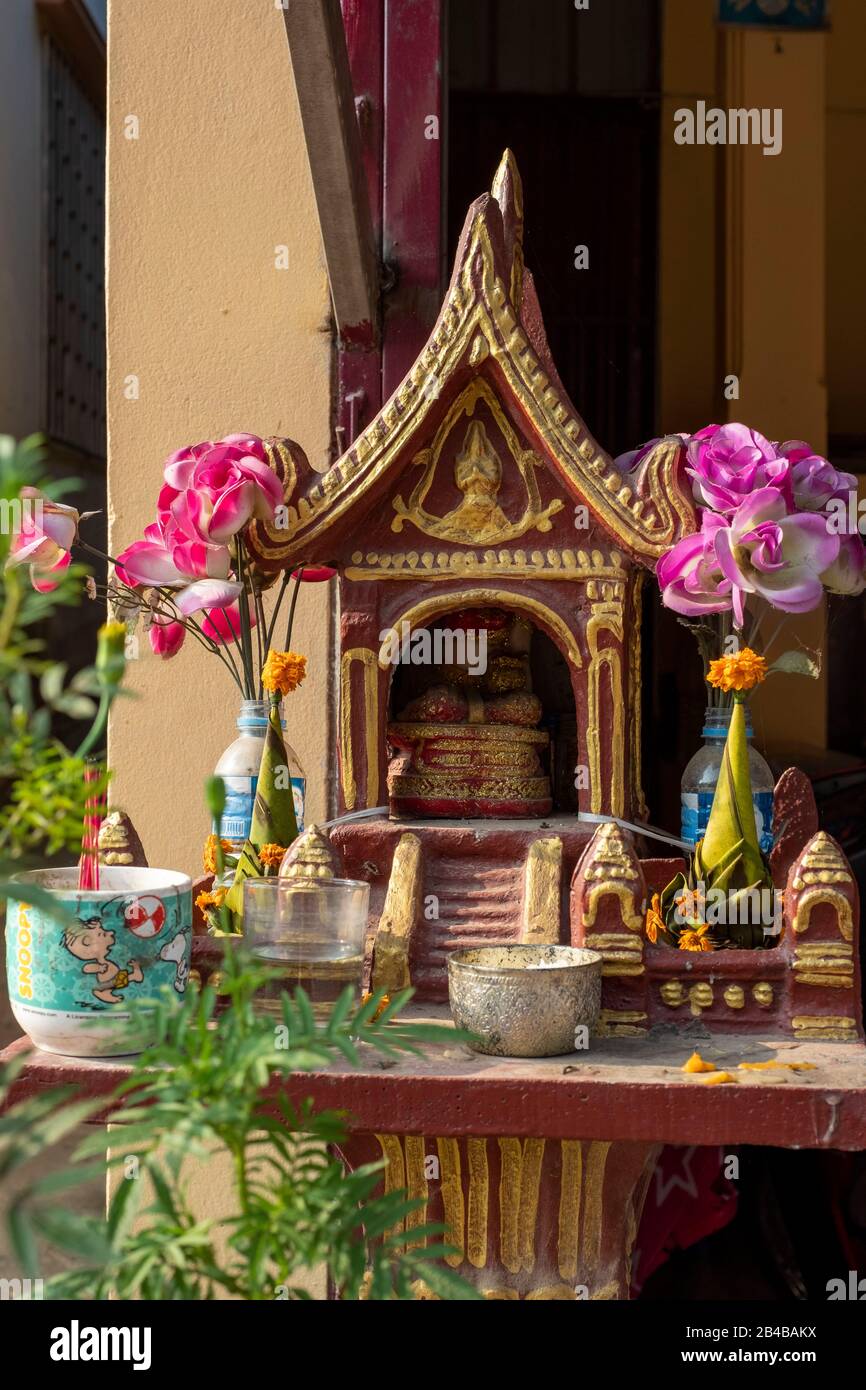 Laos, Phongsaly province, Muang Khua town, altar in front of a house ...