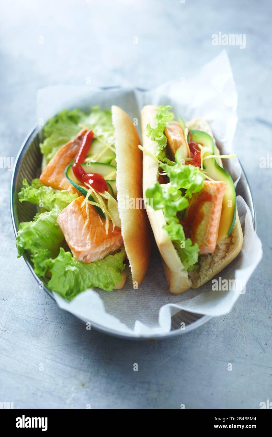 Ketchup dish, lemon zest salmon sandwich Stock Photo - Alamy
