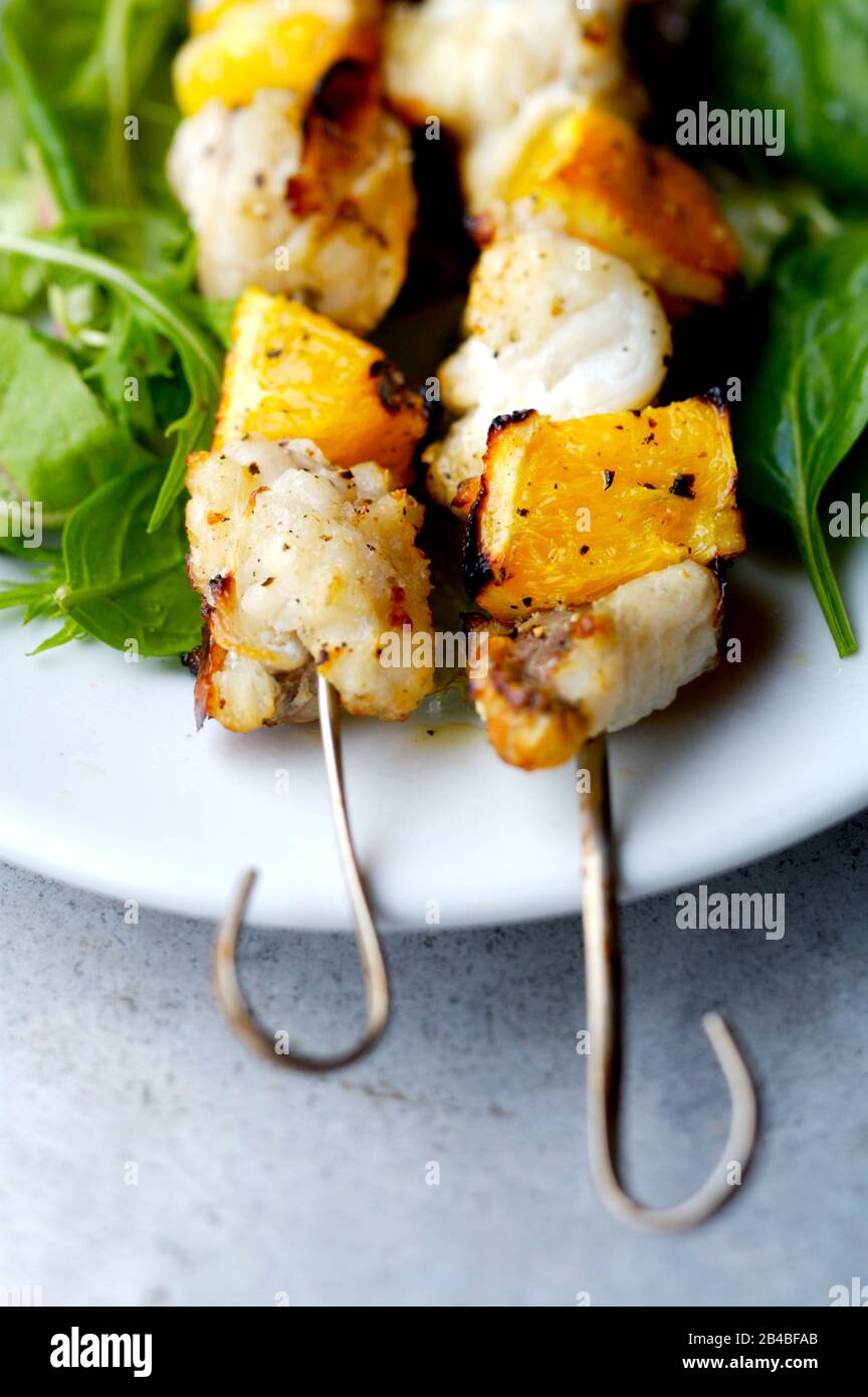 Monkfish brochette with orange and olive oil Stock Photo - Alamy