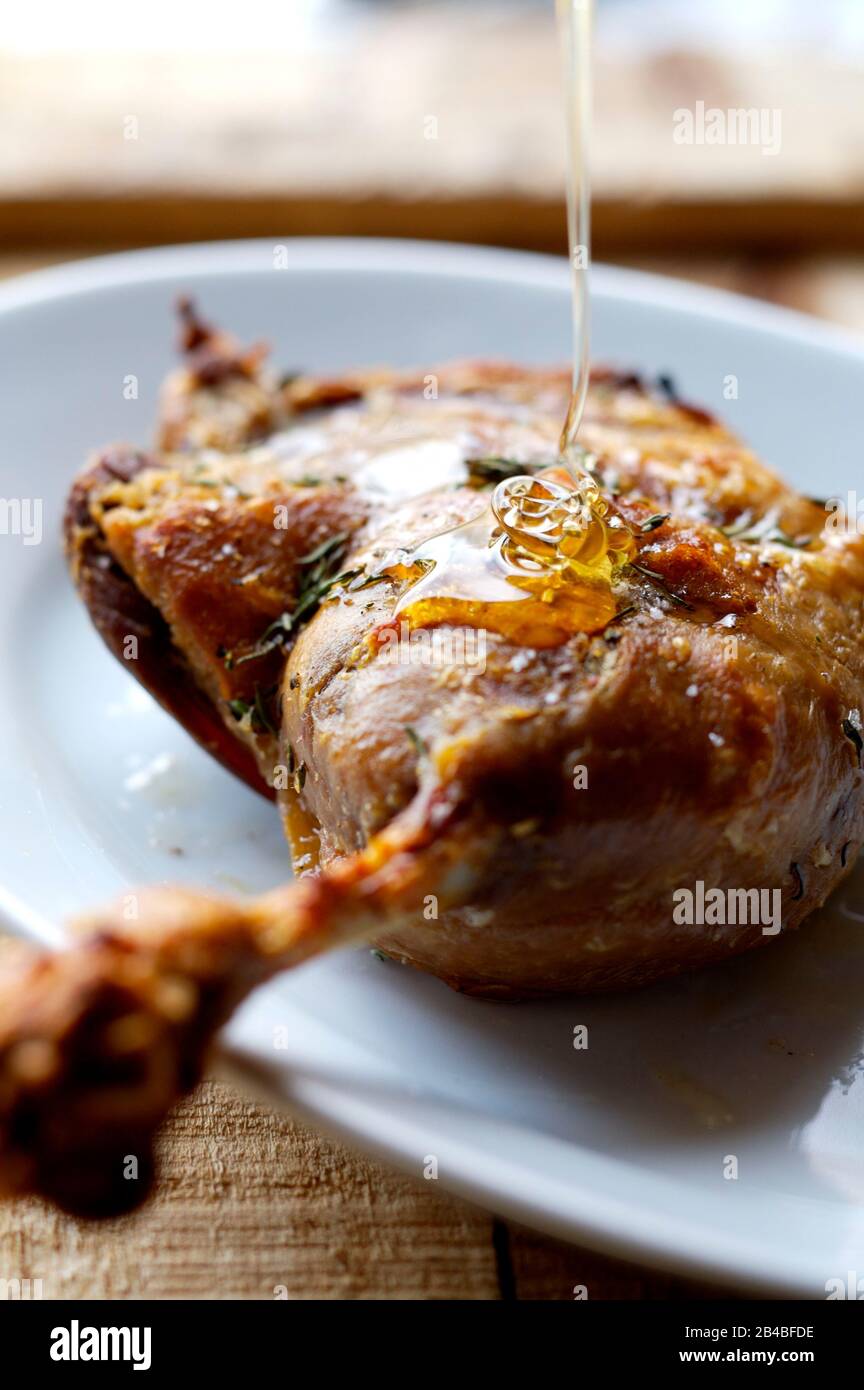 Duck leg confit and grilled with honey and ginger Stock Photo - Alamy