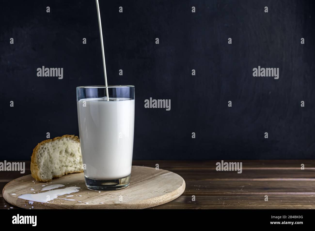 dairy products milk on a black background with copy space. concept raw ...