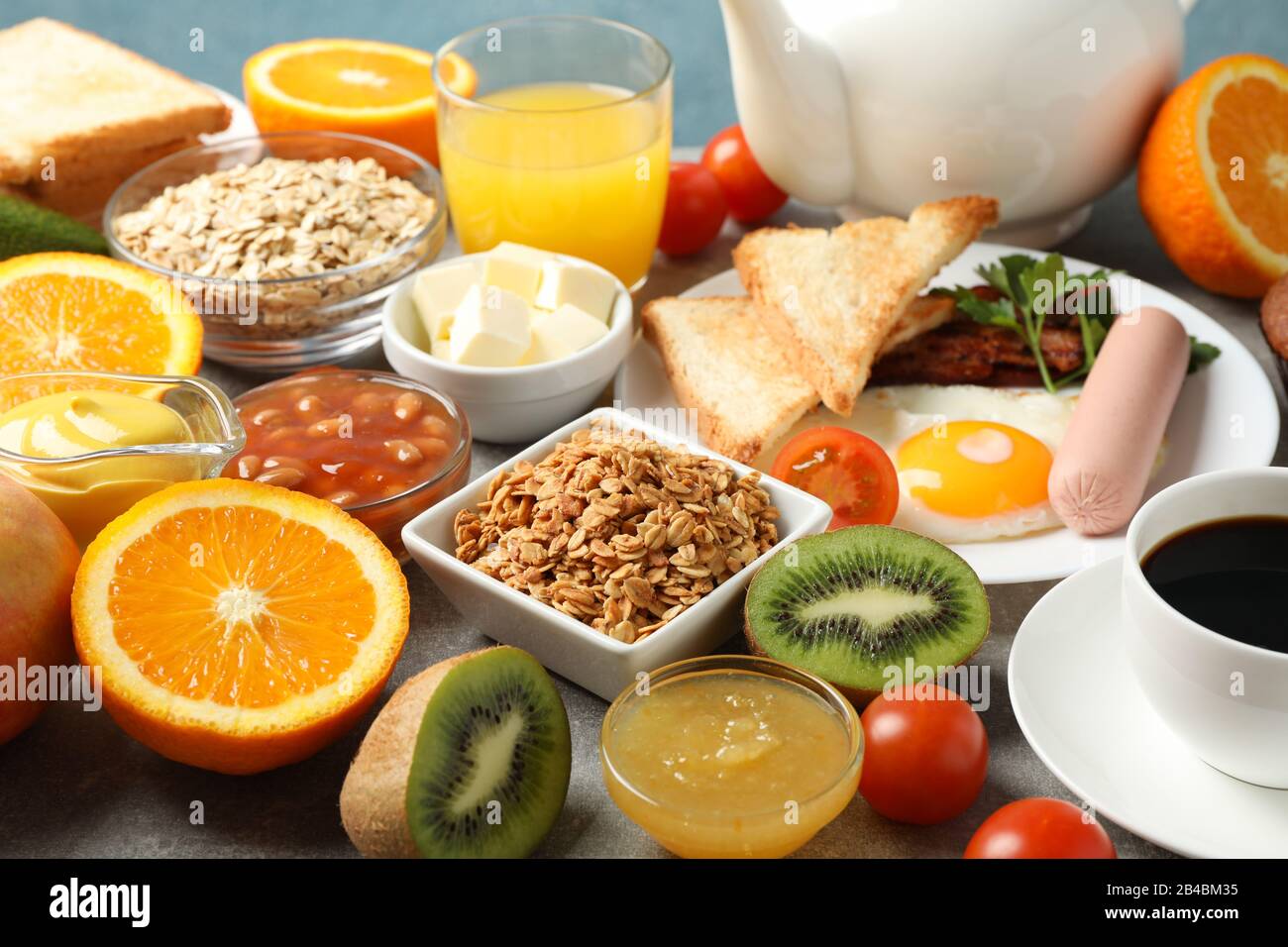 Delicious breakfast or lunch background. Grey table Stock Photo - Alamy