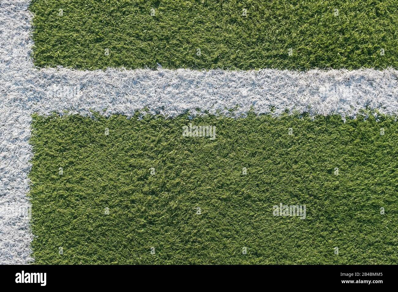 White strip in the field for football. Green texture of a football ...
