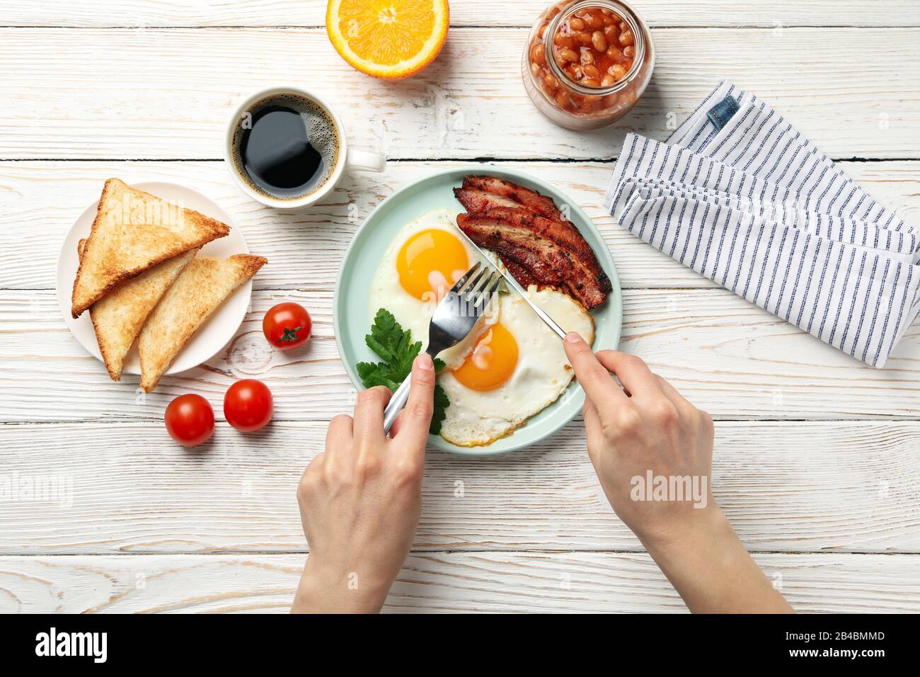 Person eating breakfast fat hi-res stock photography and images - Alamy