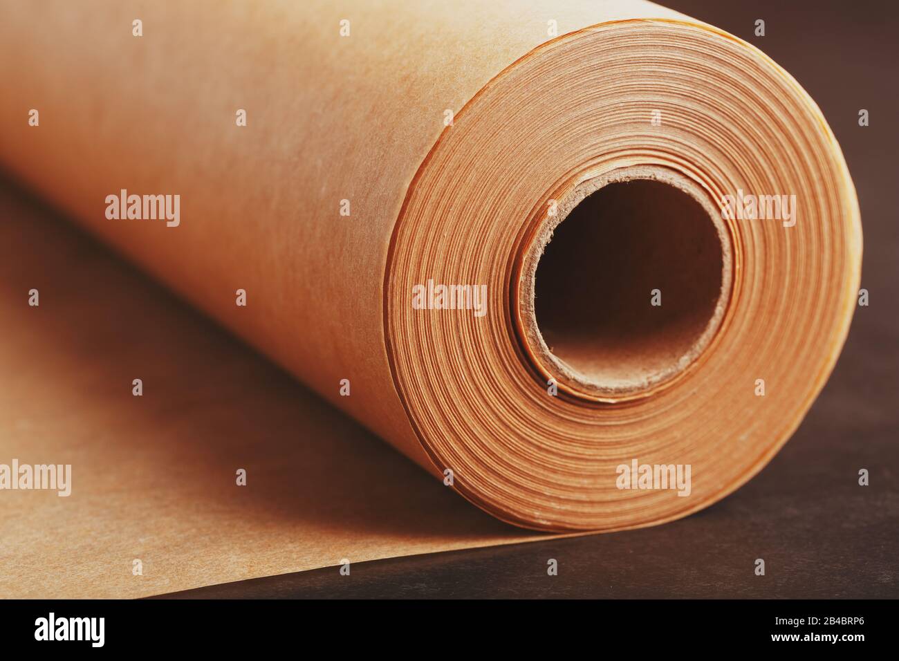 Vintage paper unfolded from a roll on a dark background. Papyrus ...