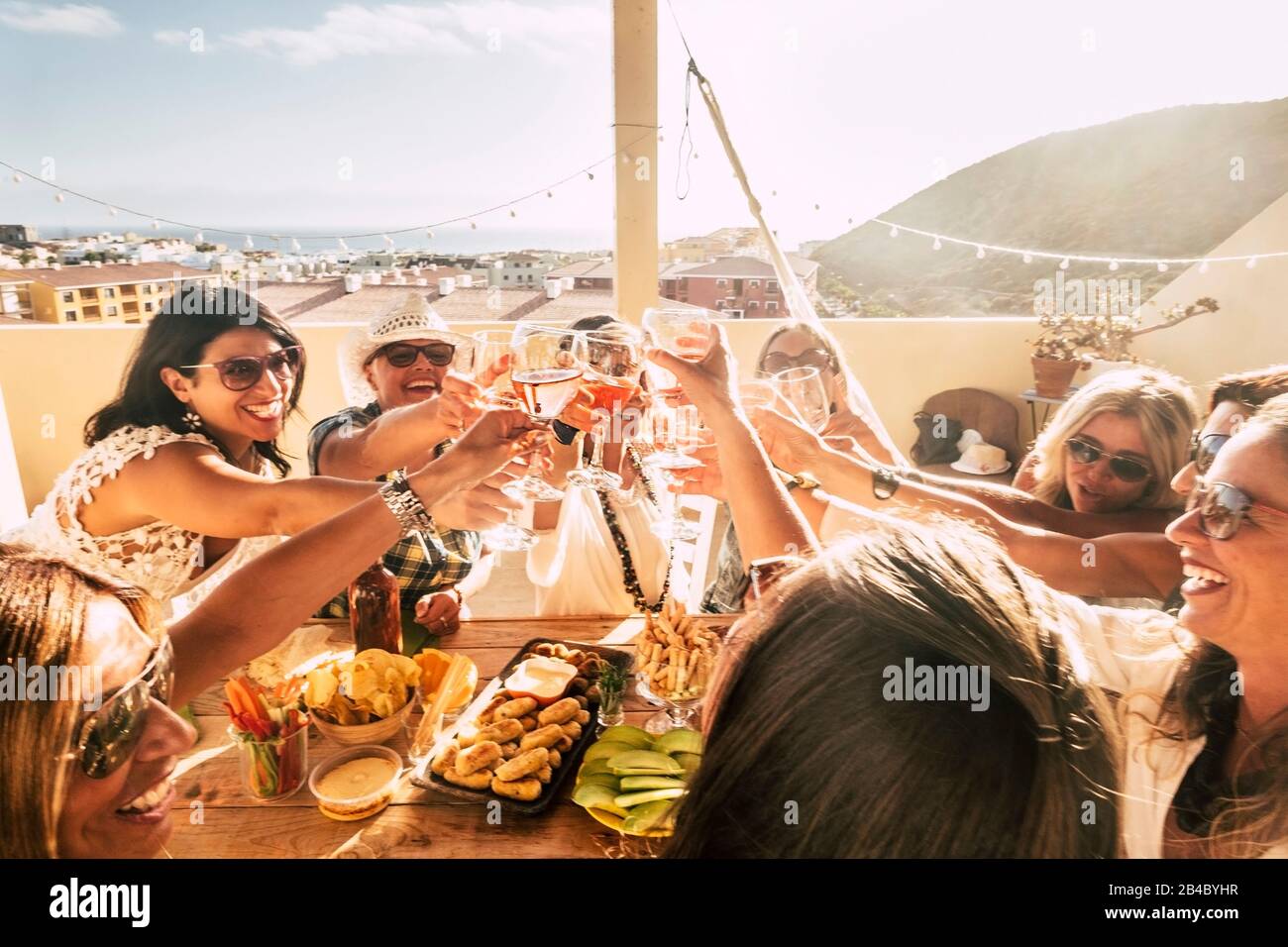 Womens having fun celebrating together outdoor - people group toasting ...