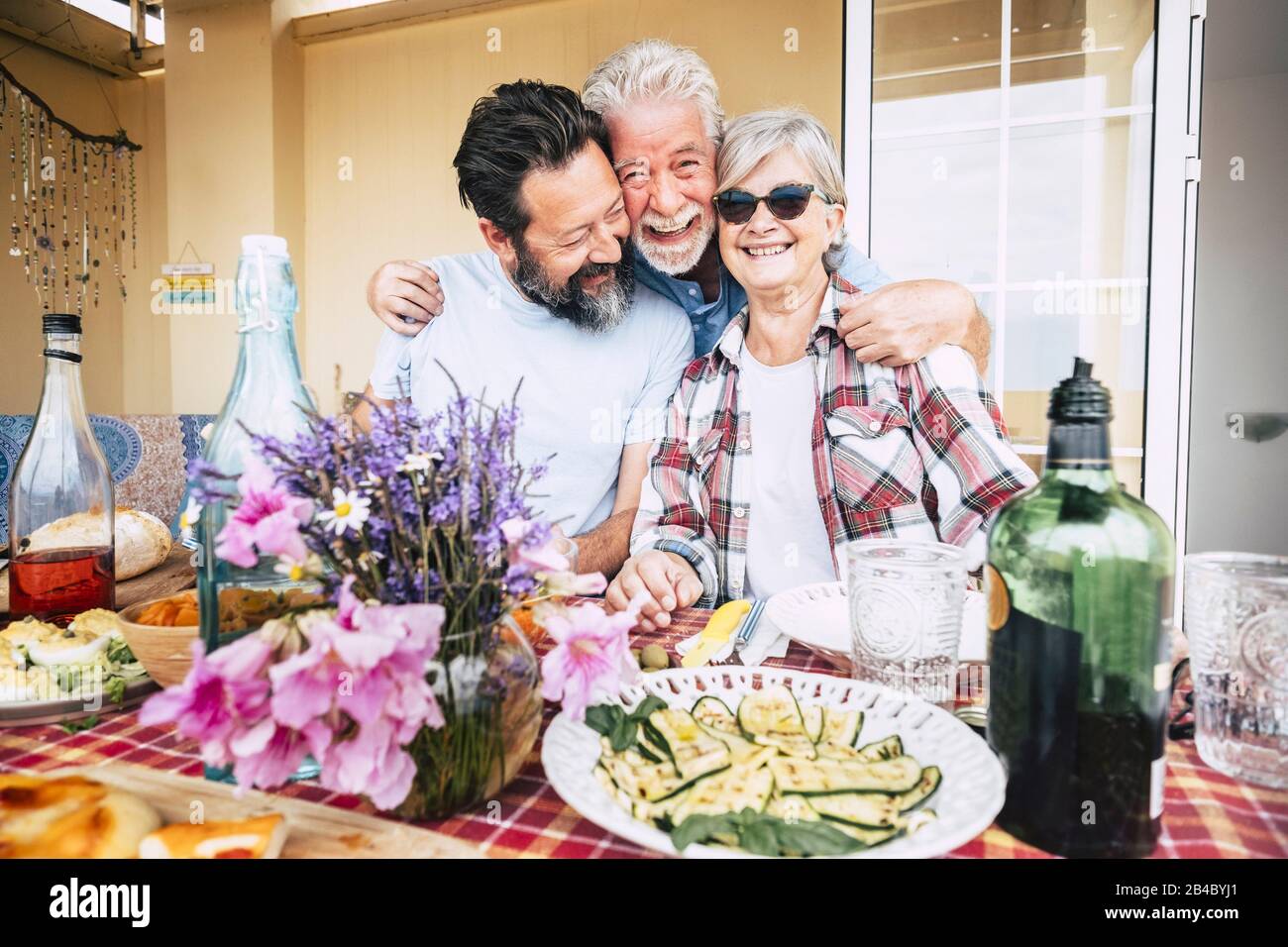 Happy family people aged senior adult portrait hugging and having fun ...