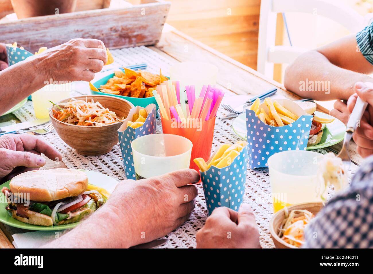 Friends people eating junk tasty hamburger food together in fast food ...