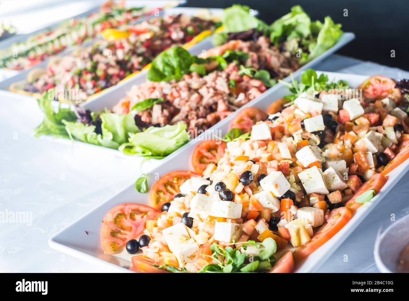 Buffet with different kind of food with fish and vegetables for ...