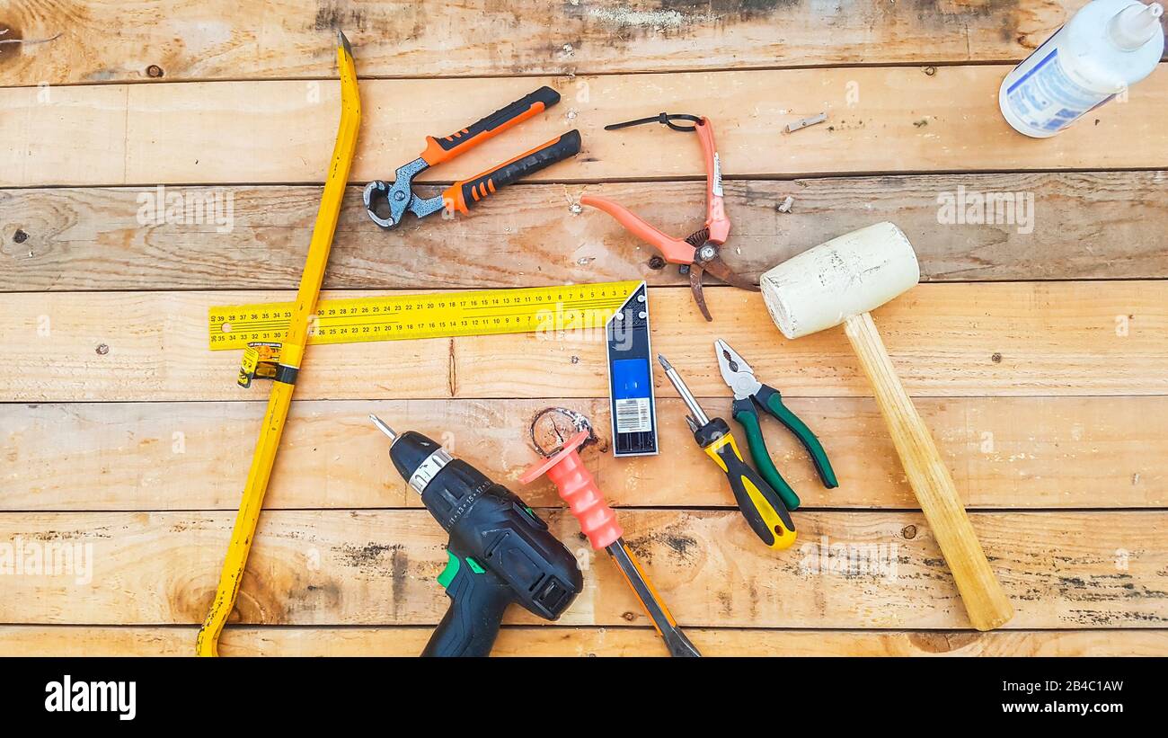 Above view of mixed hardware stuffs on a wood table maded by recycled ...