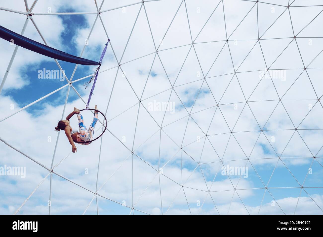 Young fitness perfect body people girl athlete do aerial exercises with ...