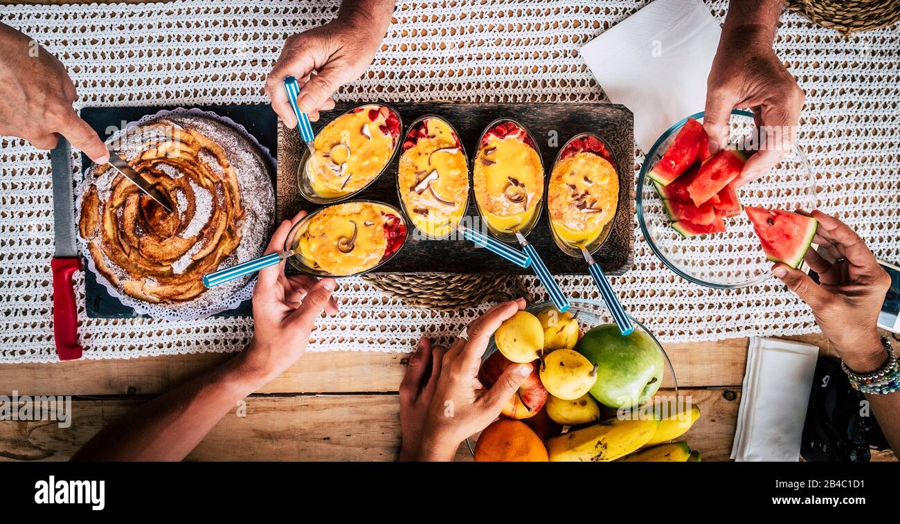Appetizer table with food viewed from above with people friendship ...