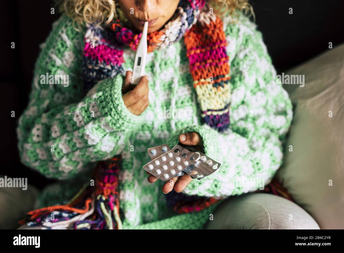 Close up of adult woman at home in winter with seasonal illnes cold ...