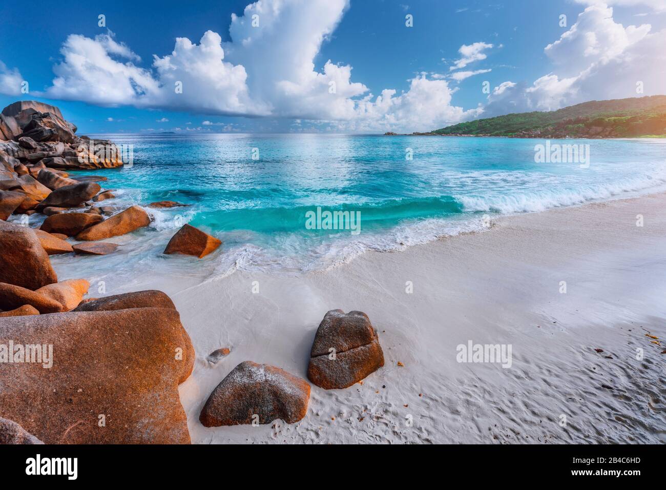 Impressive clouds above crystal clear ocean and beautiful tropical ...