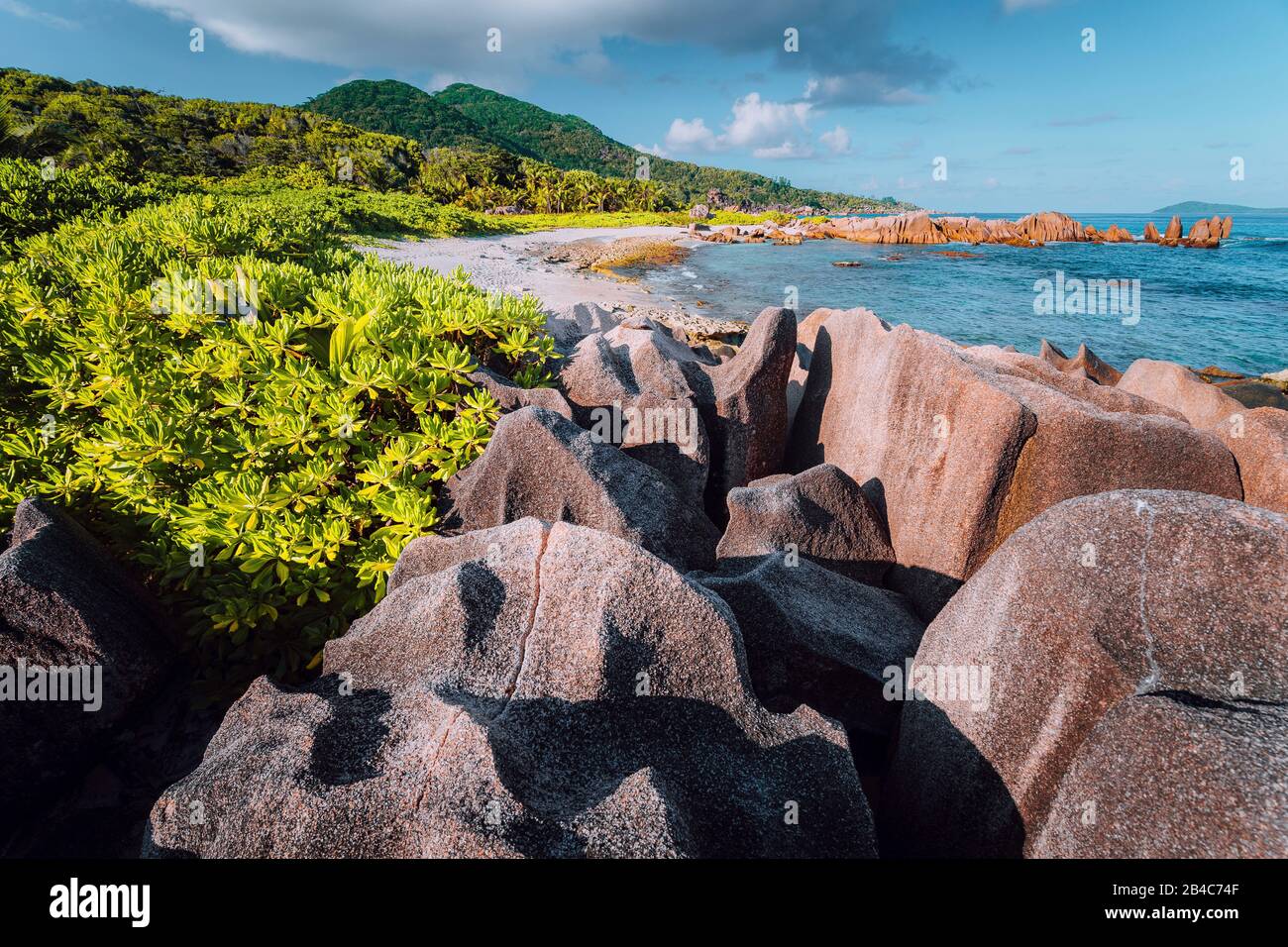 Natural tropical and isolated beach with big granite rocks hi-res stock ...
