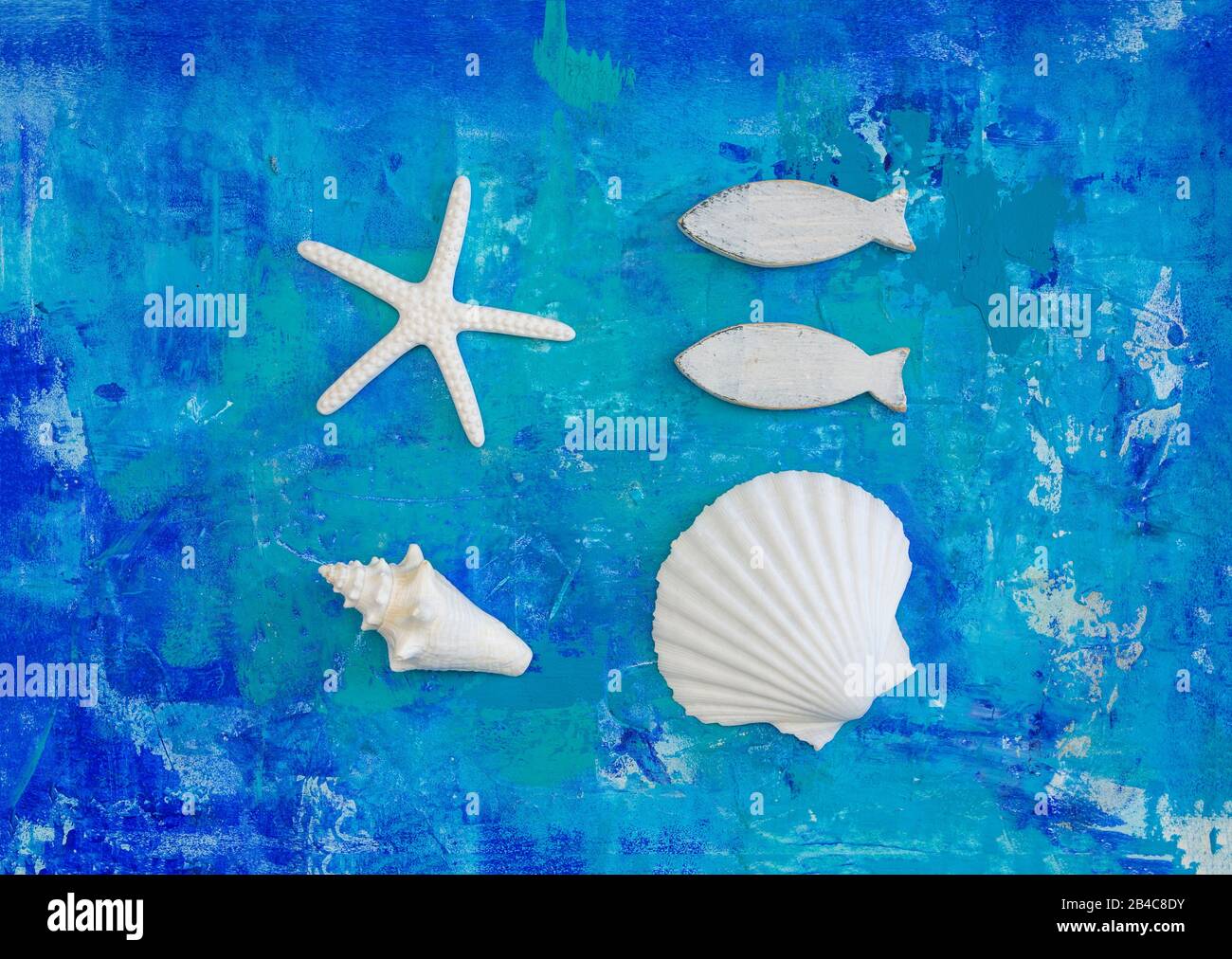 maritime still life of white shells and fish on blue and turquoise ...