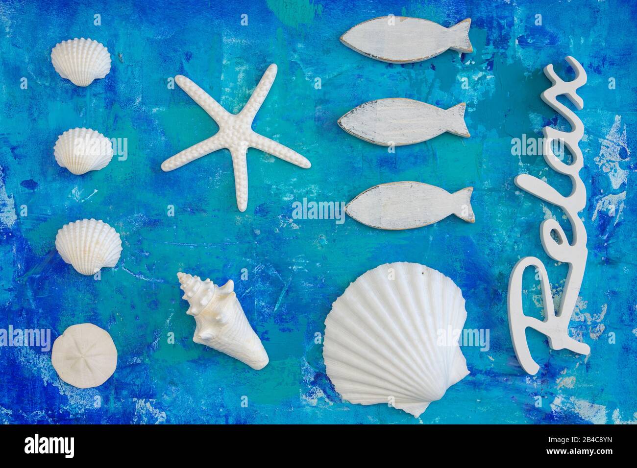 maritime still life of white shells and fish on blue and turquoise ...