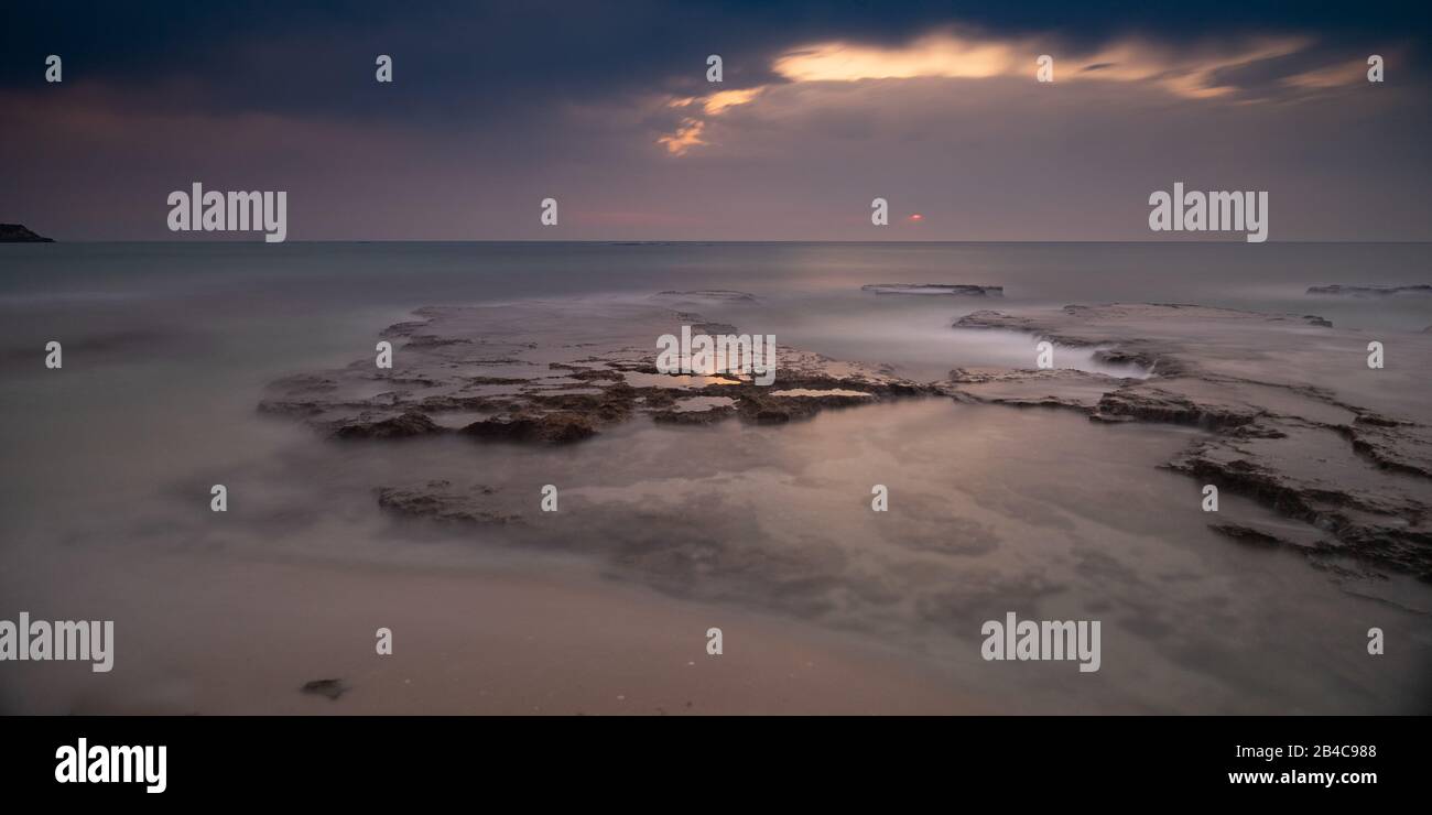 Dramatic clouds under water and windy weather sunset Stock Photo - Alamy
