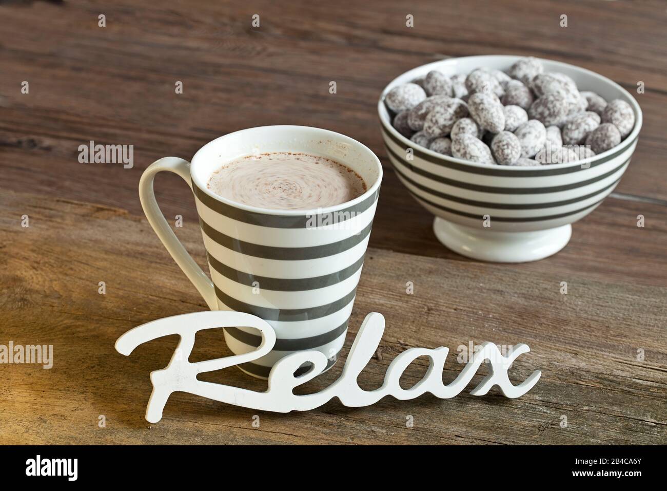 snack and cup with hot chocolate with wooden word relax Stock Photo - Alamy