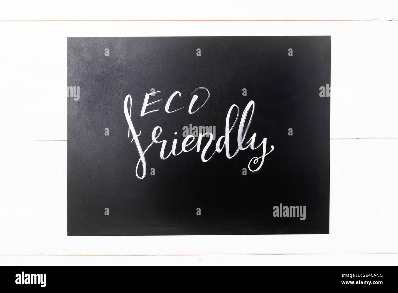 lettering eco friendly , message on a black chalkboard on a white ...