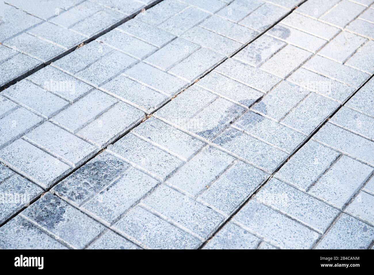Wet footprints of a man on the pavement Stock Photo - Alamy