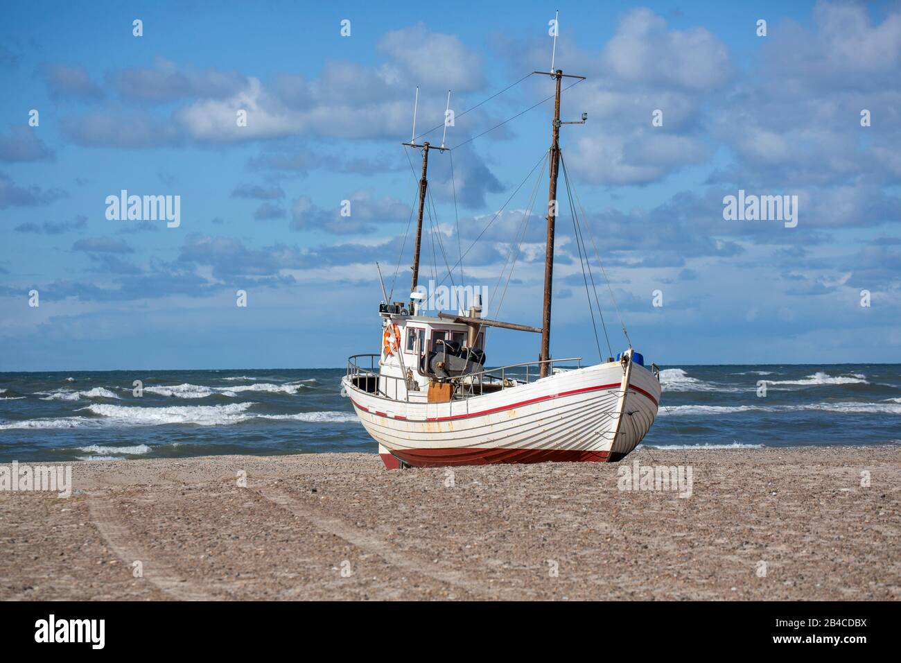Fishing boat at the beach of North Jutland in Denmark on a clear summer ...