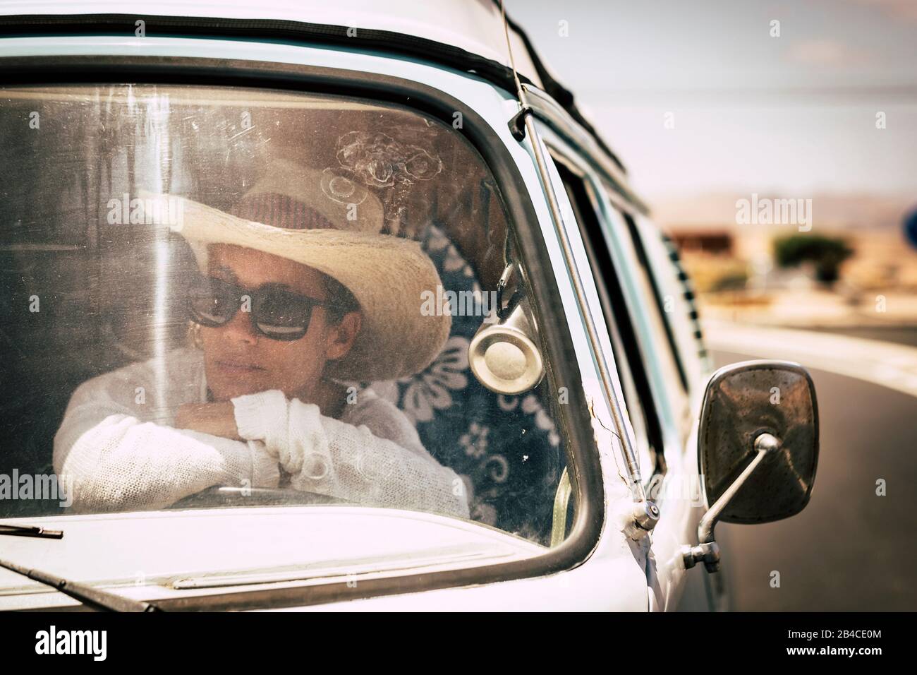 Travel concept with beautiful independent caucasian adult woman driving ...