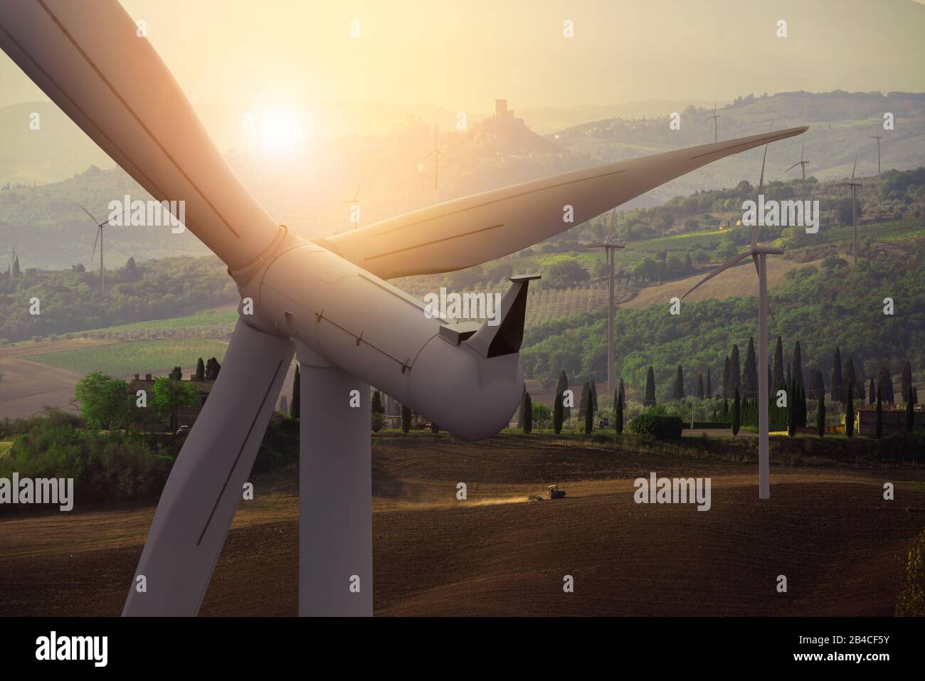 Wind turbine farm power generator in beautiful nature landscape for ...