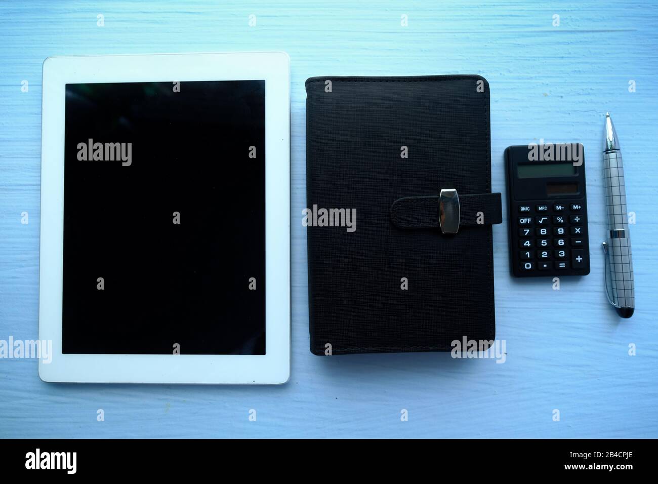 top view of digital tablet and notepad on yellow background Stock Photo ...