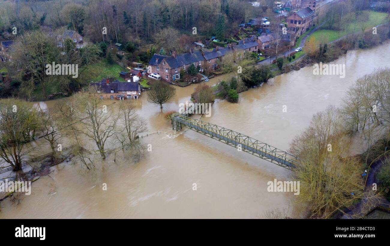 River Severn in flood in the Ironbridge Gorge The Boat Inn and Memorial ...