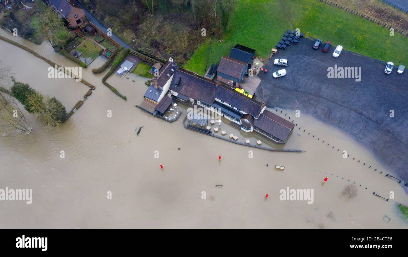 River Severn in flood in the Ironbridge Gorge The Half Moon Inn in ...