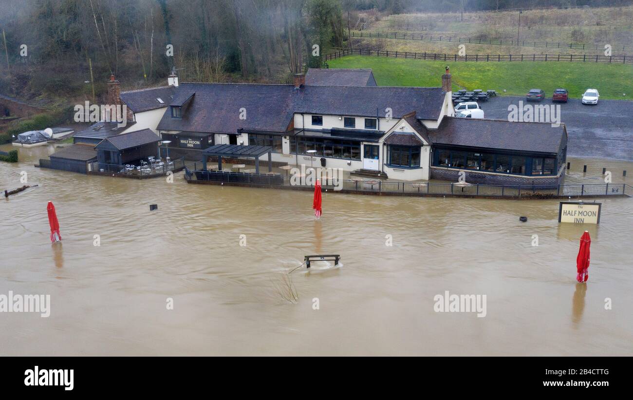 River Severn in flood in the Ironbridge Gorge The Half Moon Inn in ...