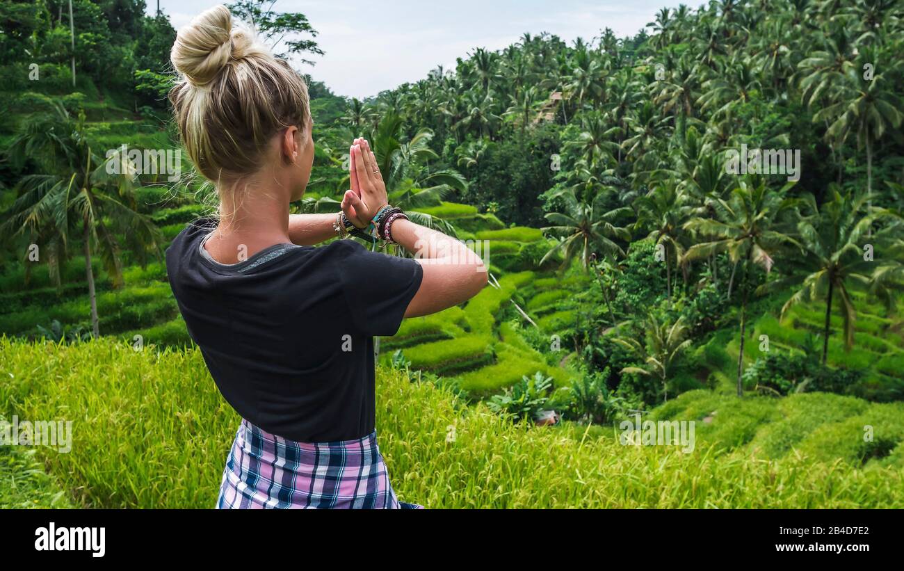 Female meditating on Tegalalang Rice Terrace, Ubud - Bali. Indonesia ...