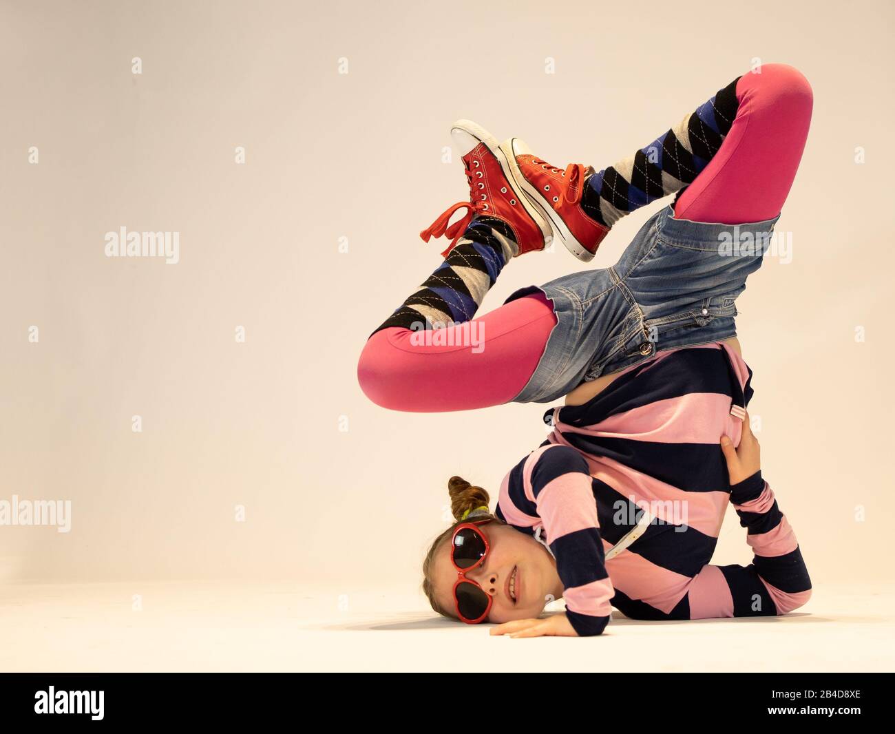 girl in a unique breakdance position,unique kid,crazy girl, cool girl ...