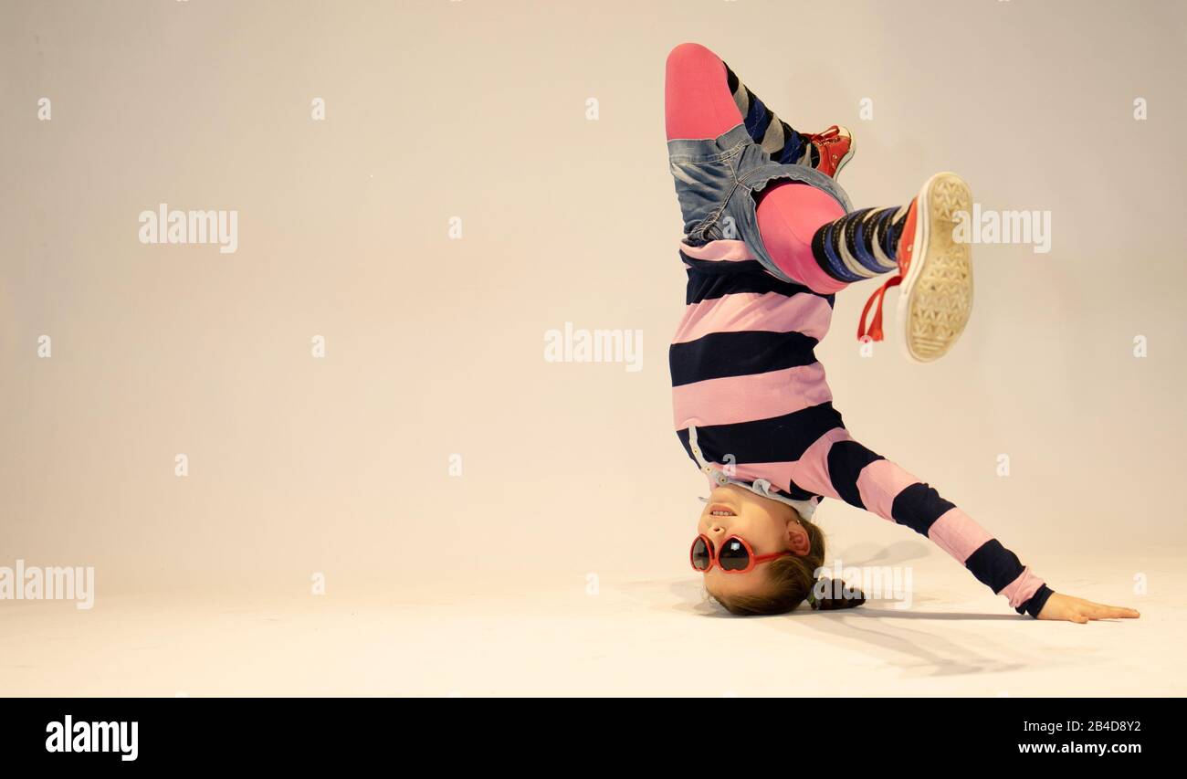 girl in a unique breakdance position,unique kid,crazy girl, cool girl ...