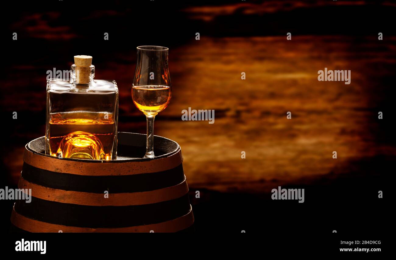 Whiskey bottle and glass, whiskey cellar, whiskey barrels Stock Photo ...