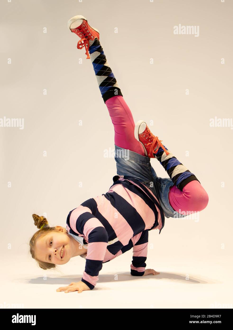 girl in a unique breakdance position,unique kid,crazy girl, cool girl ...