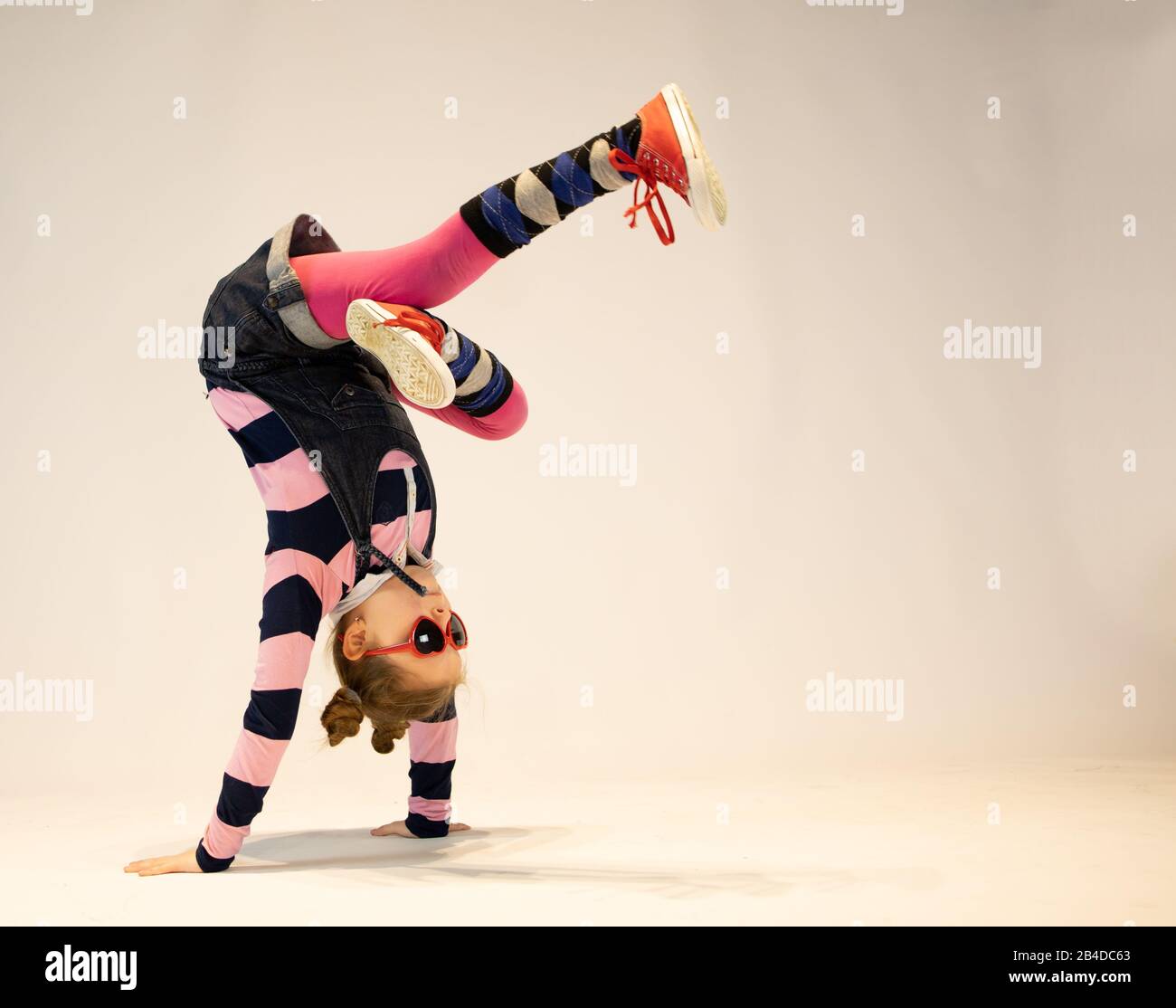 girl in a unique breakdance position,unique kid,crazy girl, cool girl ...