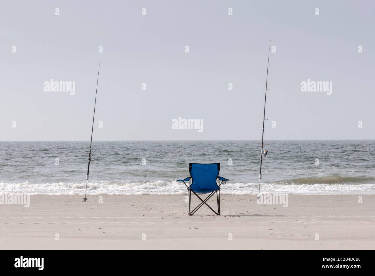 Relax while fishing on the beach Stock Photo - Alamy