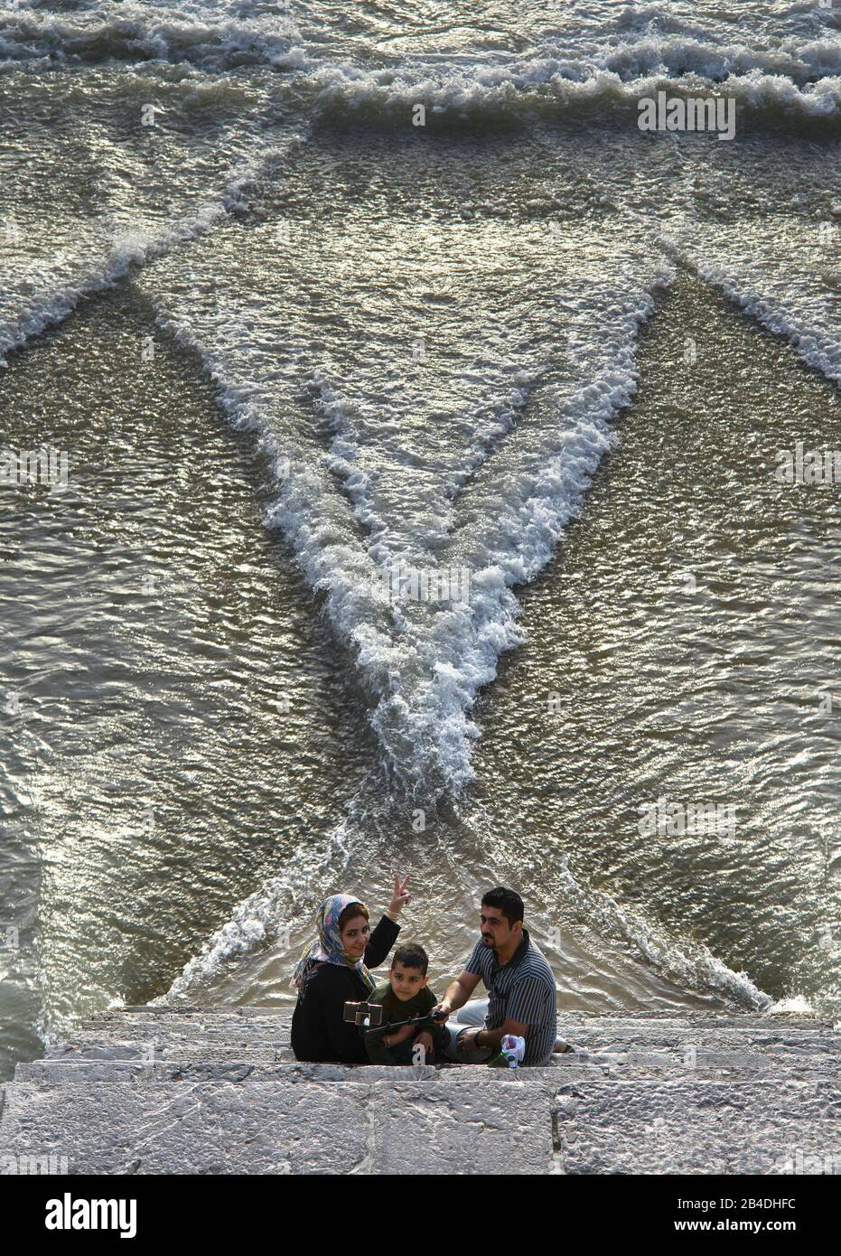Traffic. 25th Apr, 2017. A family sits on the Khadju Bridge across the ...